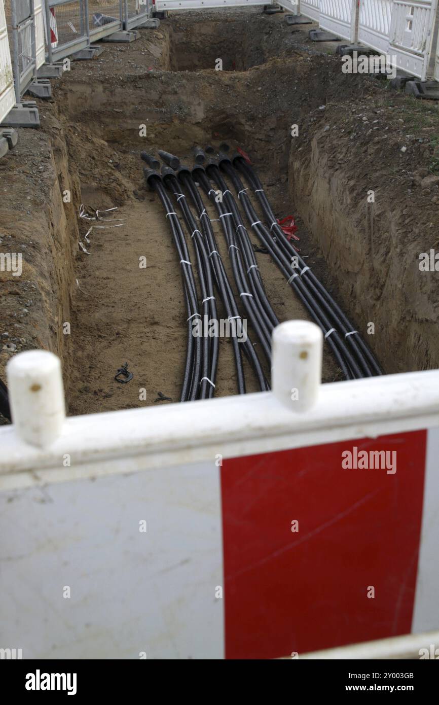 Excavation pit with underground cables Stock Photo - Alamy