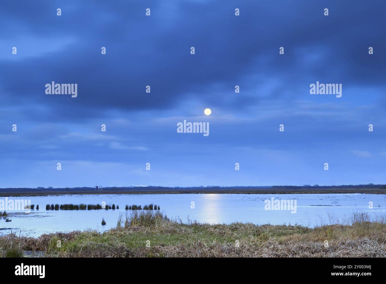 Full moon at night over lake with long exposure Stock Photo - Alamy