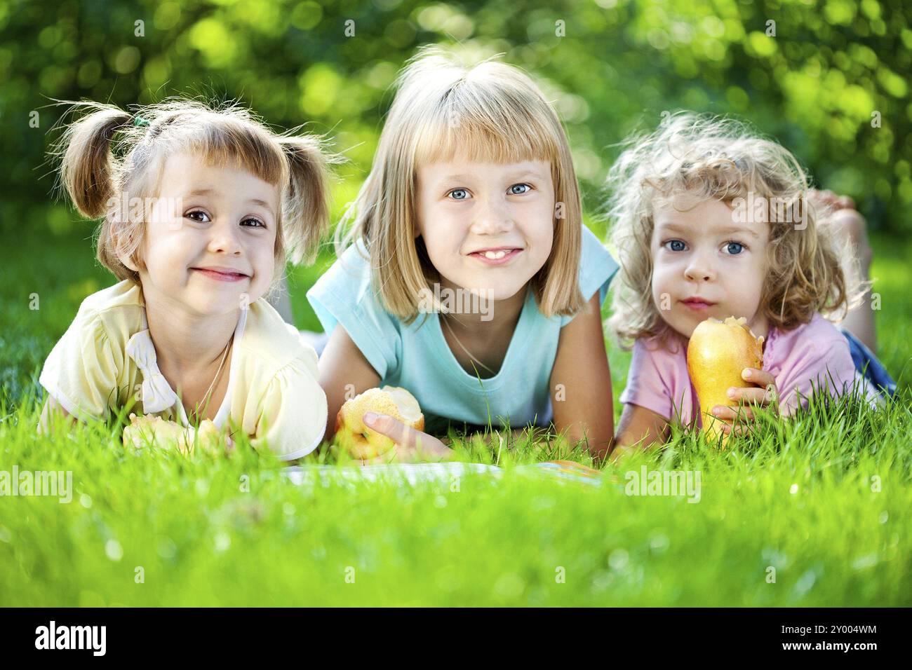 Group of happy smiling children playing outdoors in spring park Stock ...