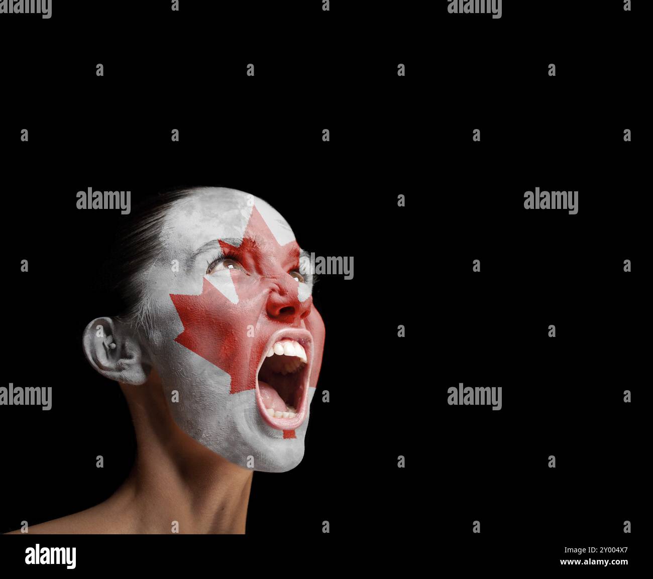 The Canadian flag on the face of a screaming woman. concept Stock Photo ...
