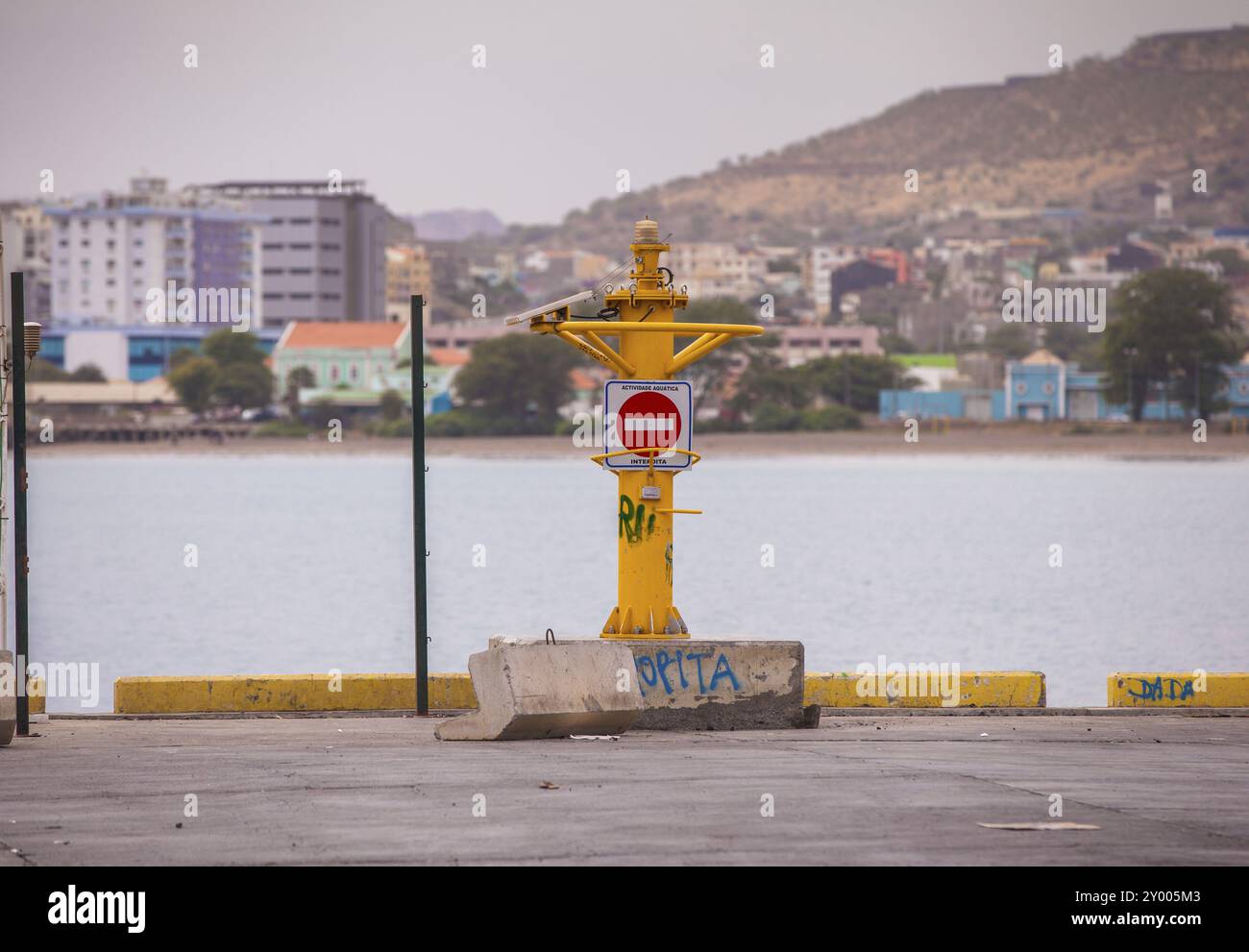 Yellow mast with traffic sign Stock Photo - Alamy