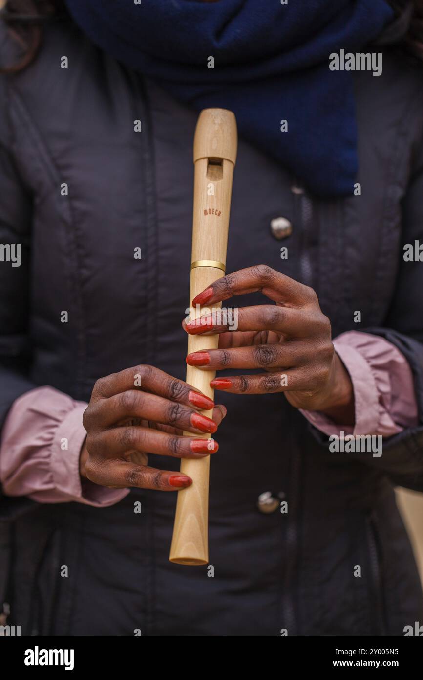 Woman holding musical instruments hi-res stock photography and images ...