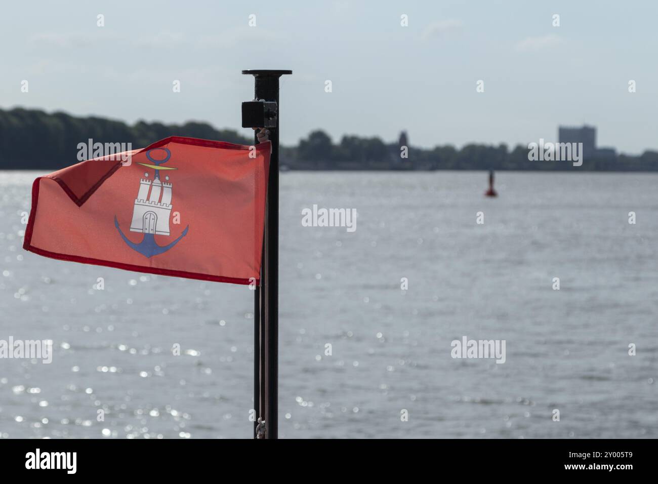 Close-up of a flag with the coat of arms of the city of Hamburg and ...