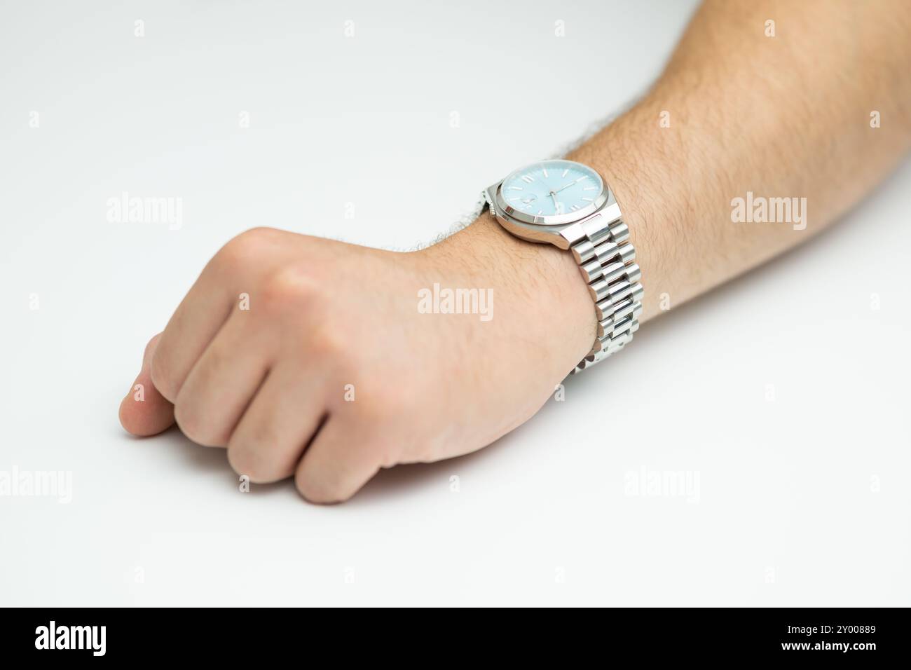 Modern silver watch on a man's wrist isolated on white Stock Photo - Alamy