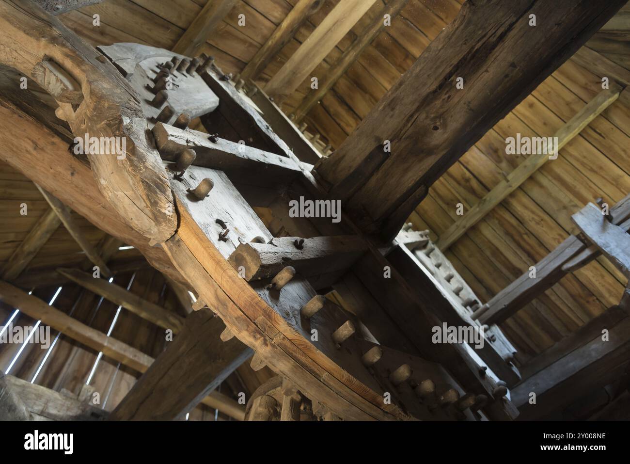 Inside a windmill with wing shaft and large gear wheel. Gotland, Sweden ...