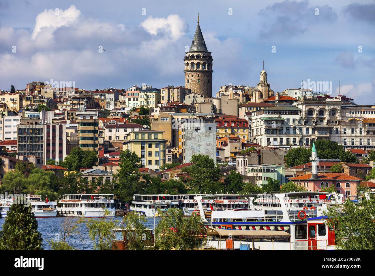 Istanbul city skyline with Galata Tower, tour boats and ferries on ...