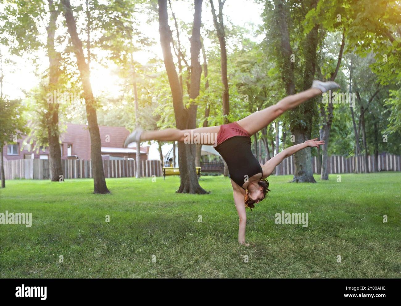 Stretching woman in outdoor exercise smiling happy doing stretches ...