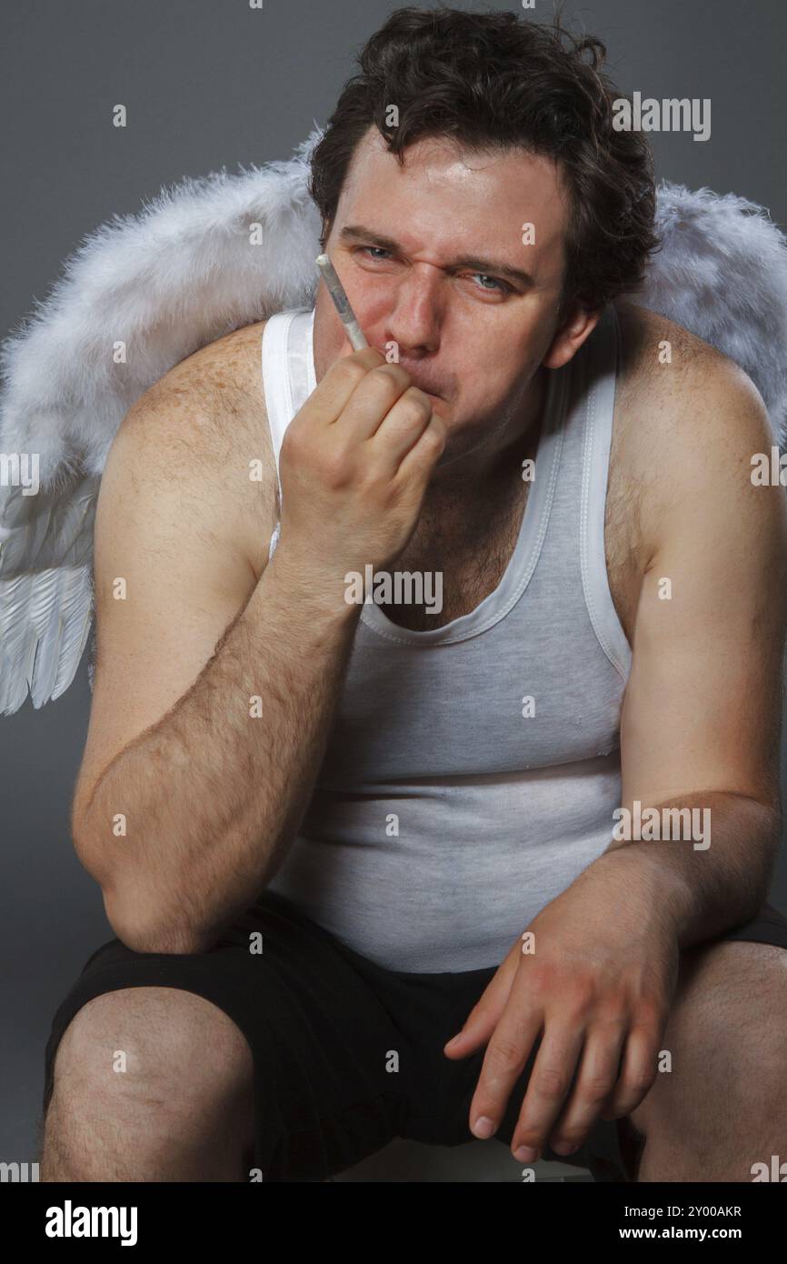 Mr. Angel with white wings. Crazy character portrait Stock Photo - Alamy