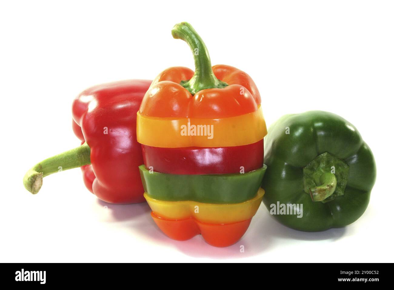 Different coloured peppers layered on a white background Stock Photo ...