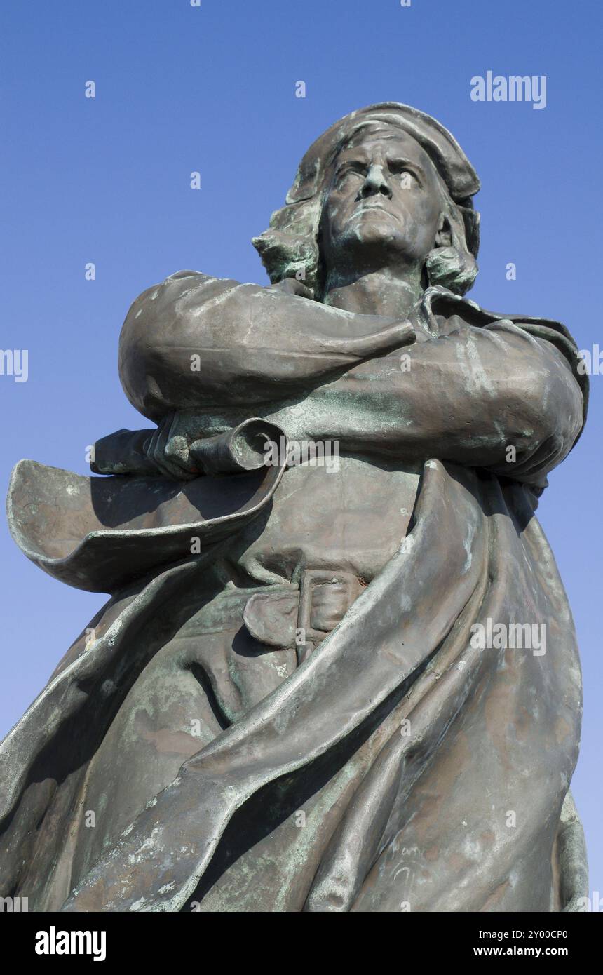 Statue of Christopher Columbus in front of a blue sky. Statue of ...