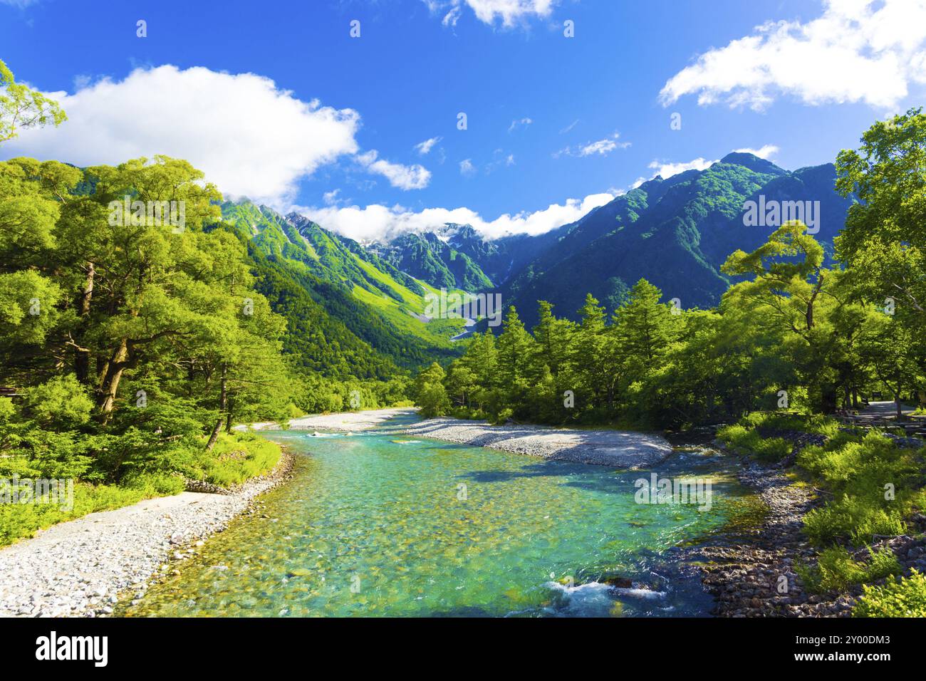 The pristine alpine water of Azusa River flowing in front of landscape view of Mount Hotaka-Dake ...