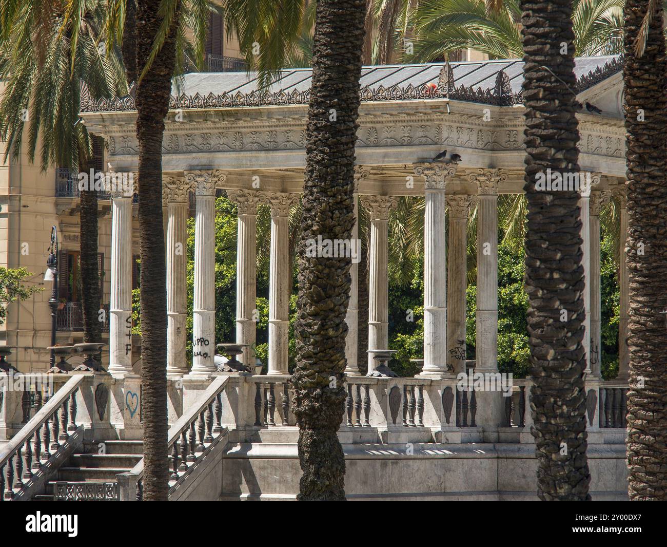 Ornate pavilion with columns, surrounded by palm trees and historic ...