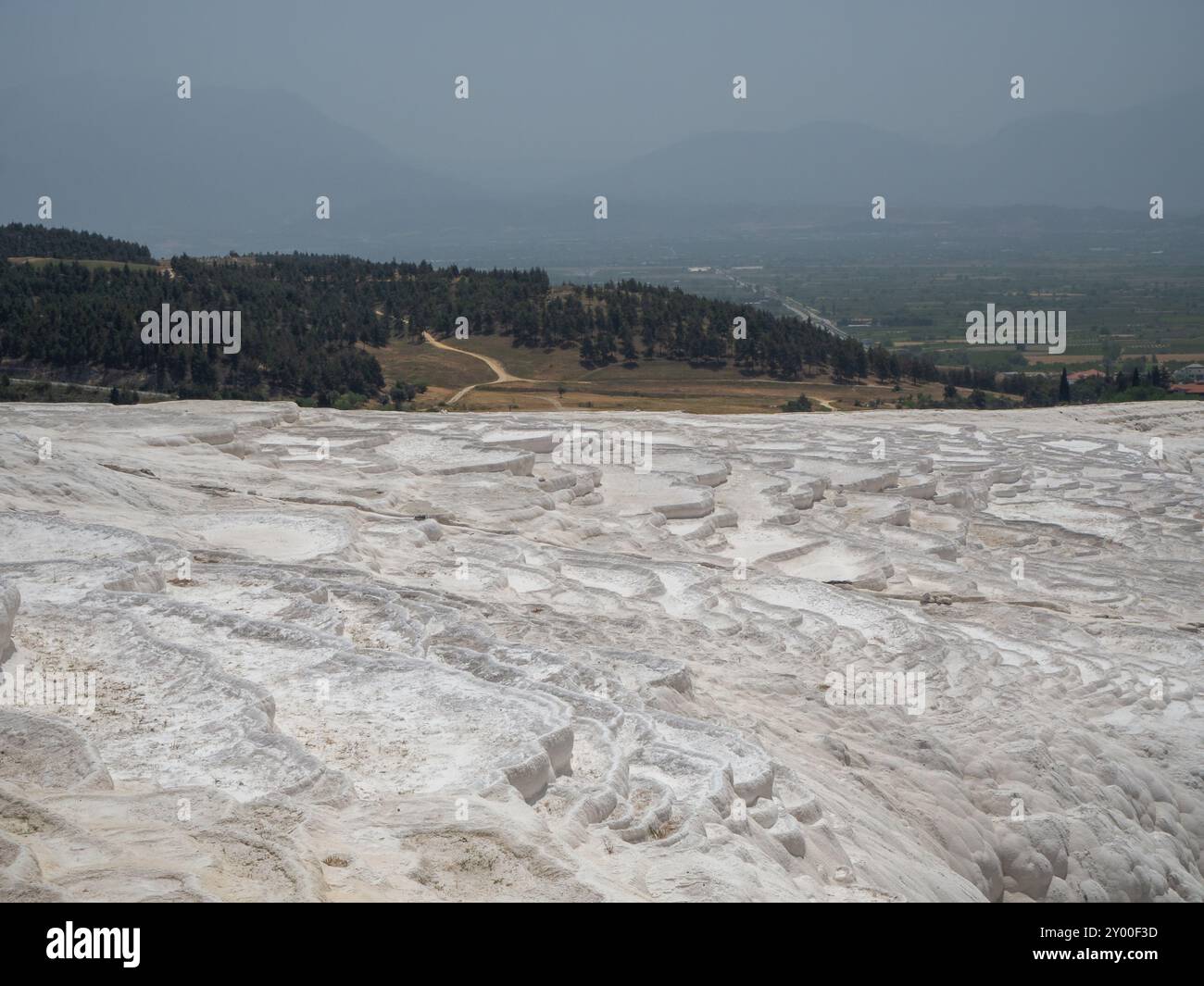 Pamukkale travertine terraces and the ancient Greek city of Hierapolis ...