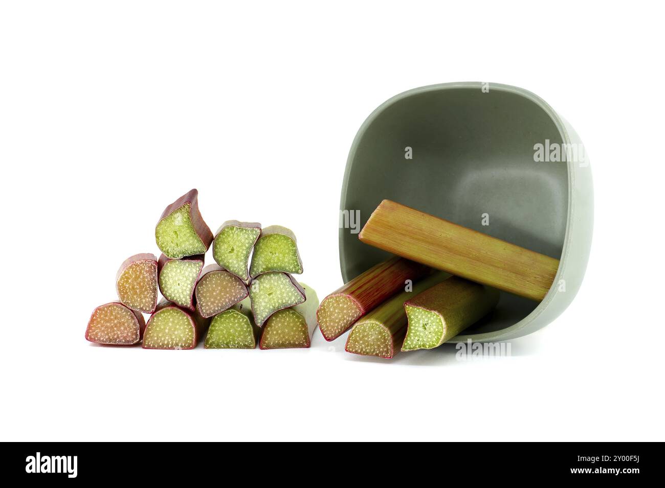 Rhubarb stalks of varying colors from pale green to deep red near bowl ...