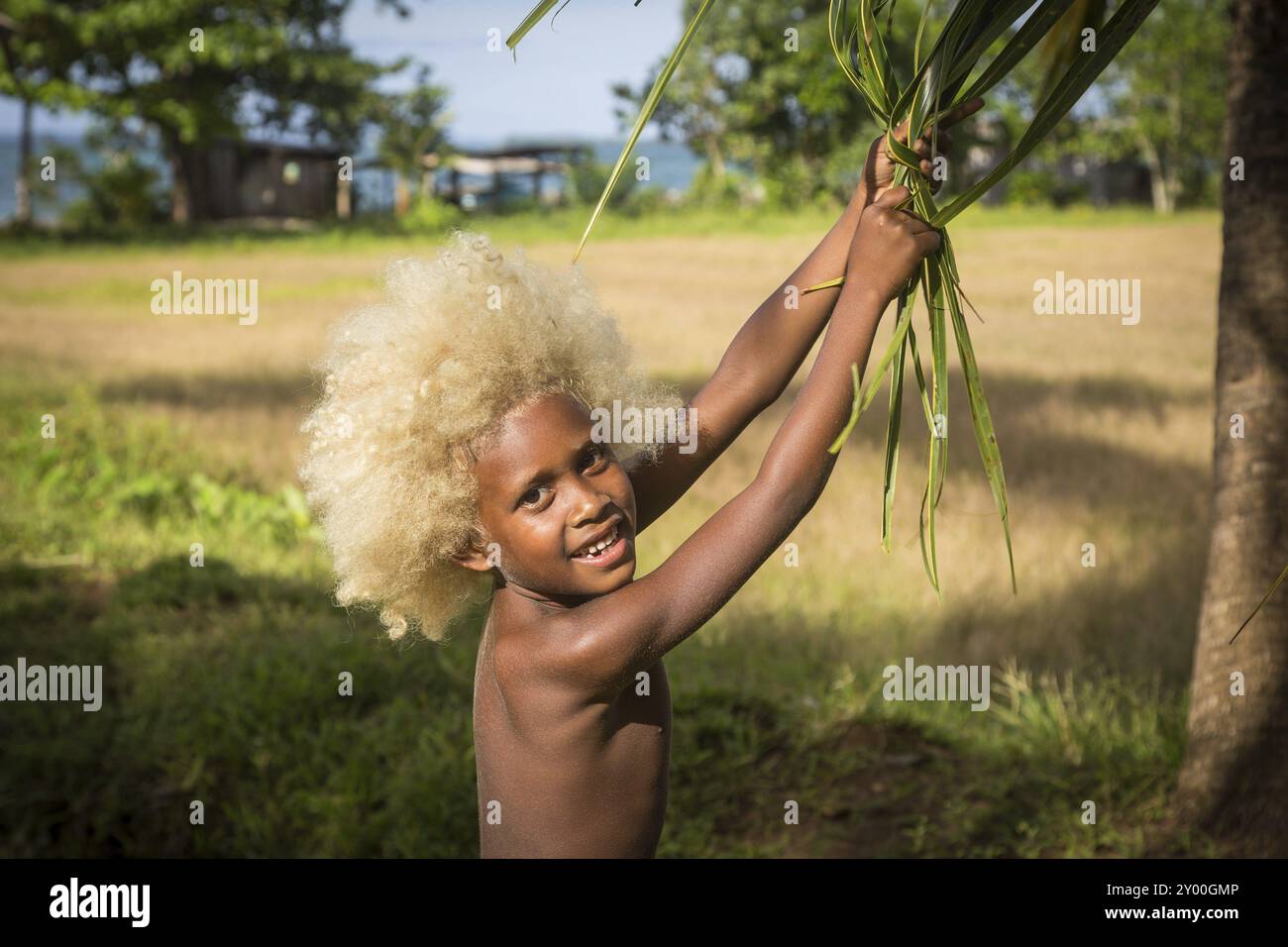 Chea Village, Solomon Islands, June 15, 2015: A boy with blond hair and ...