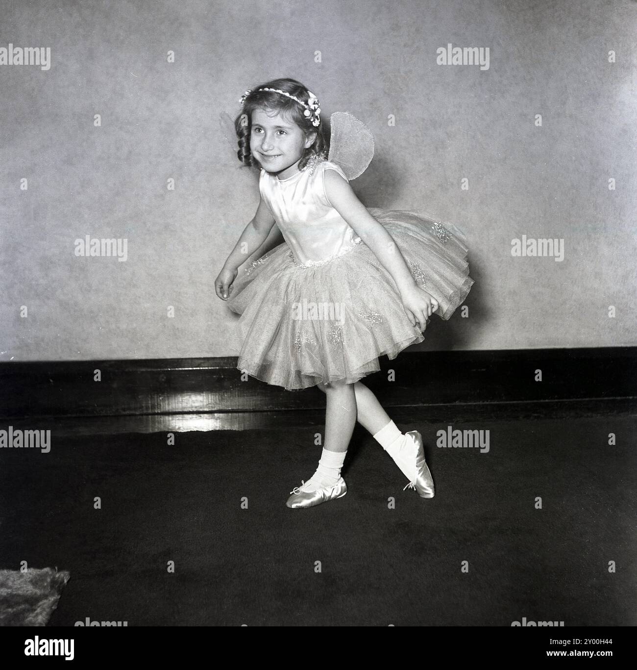 1960s, historical, young girl in her ballet costume and pointe shoes ...