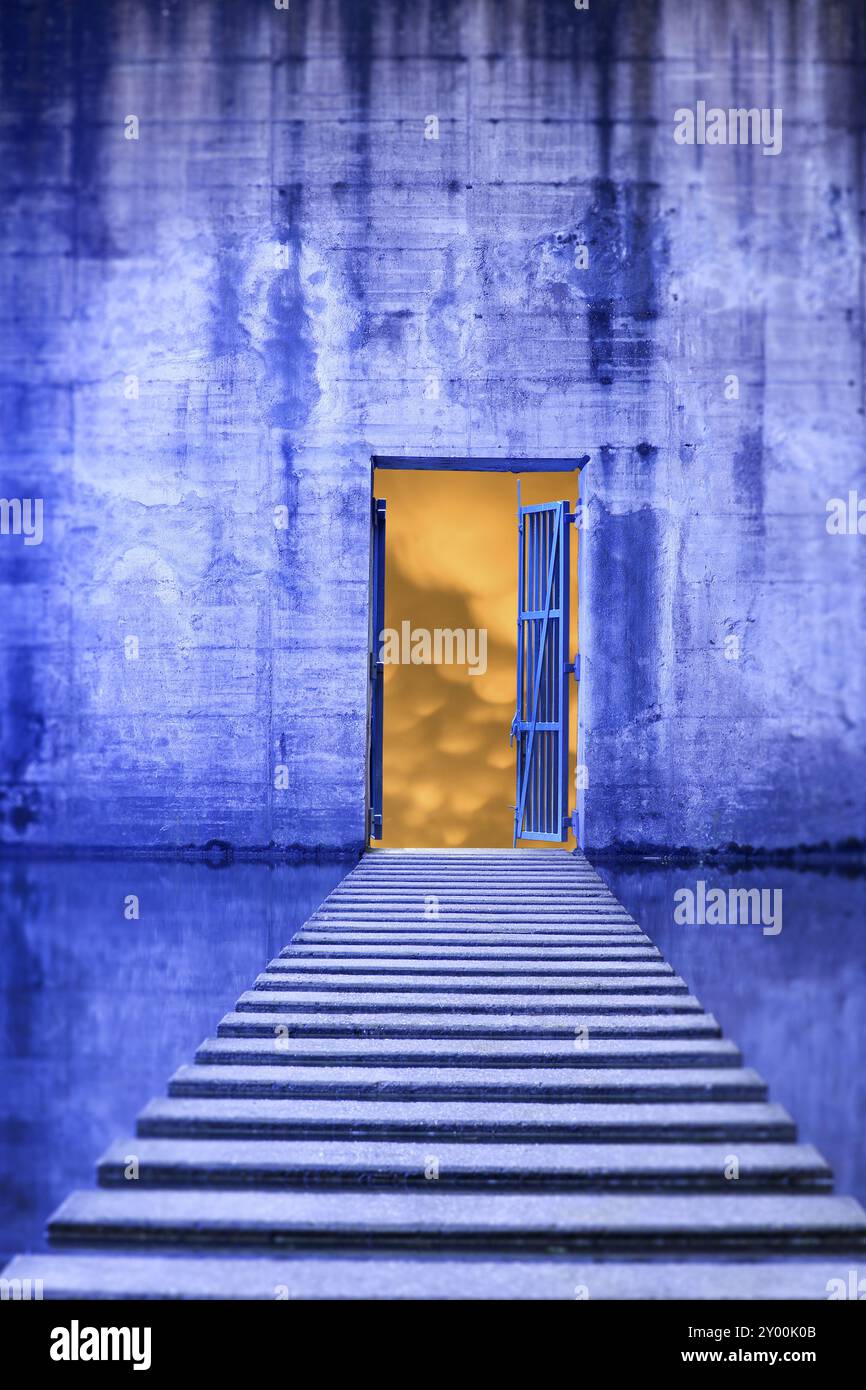 Concrete wall with open mesh door and walkway Stock Photo - Alamy