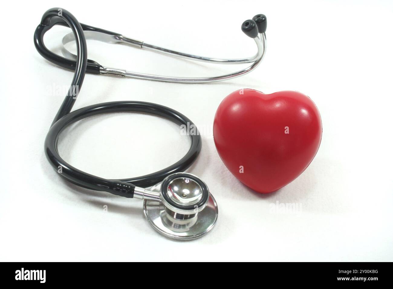 Stethoscope with red heart on a white background Stock Photo - Alamy