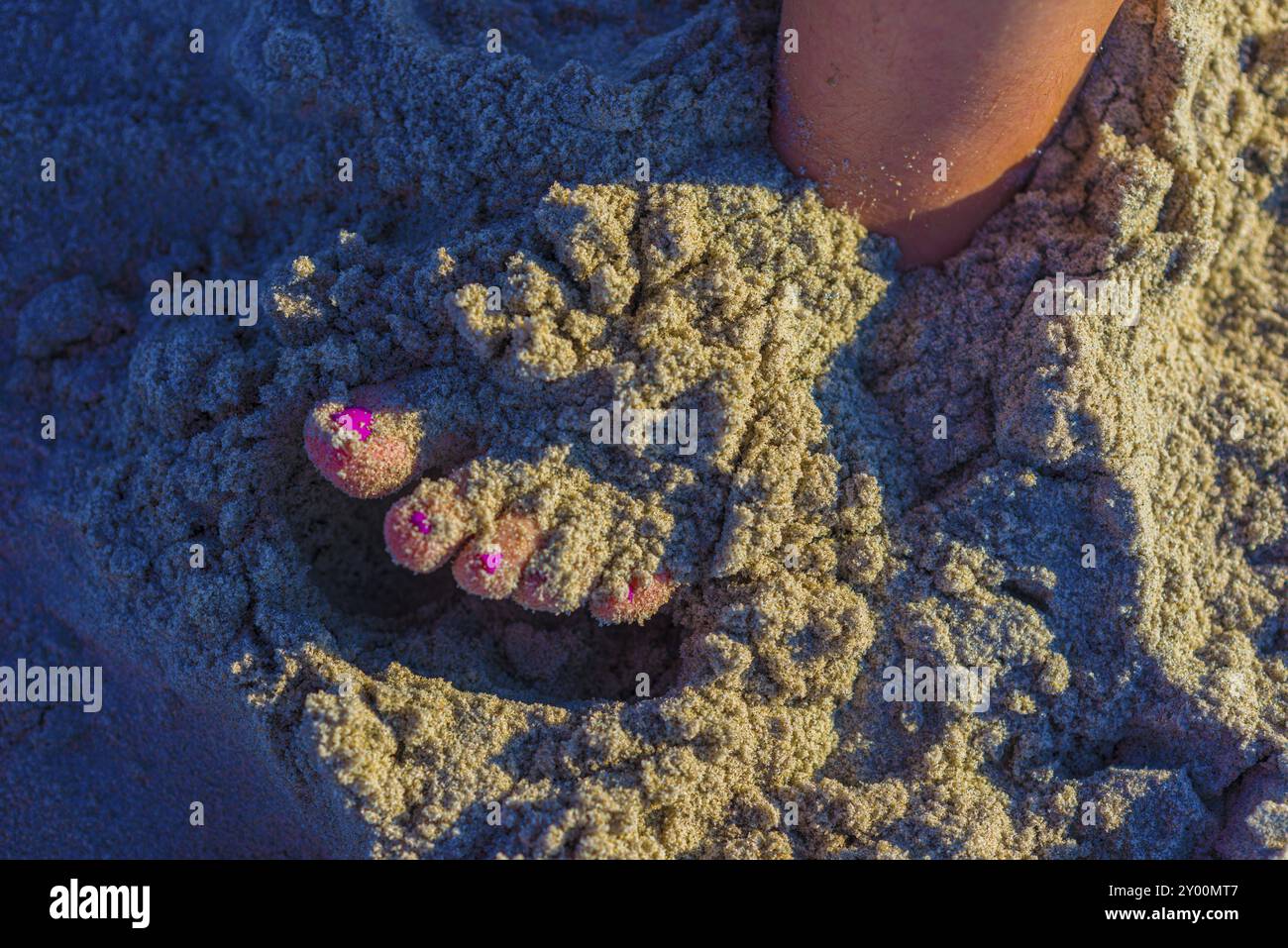 A foot with painted toe nails in sand on a beach Stock Photo - Alamy