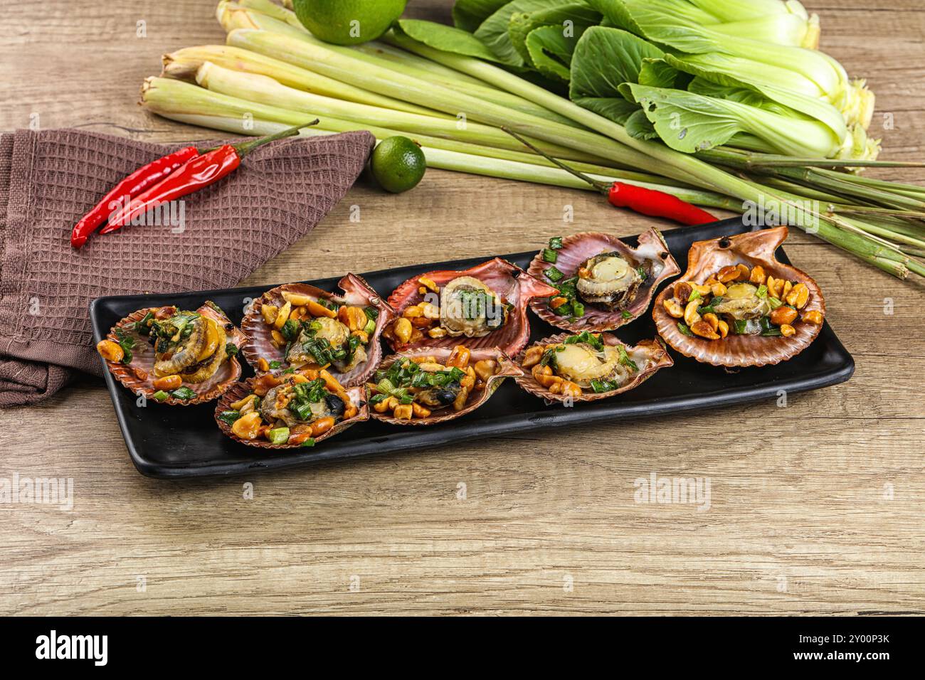 Baked scallops with scalion oil and green onion Stock Photo - Alamy