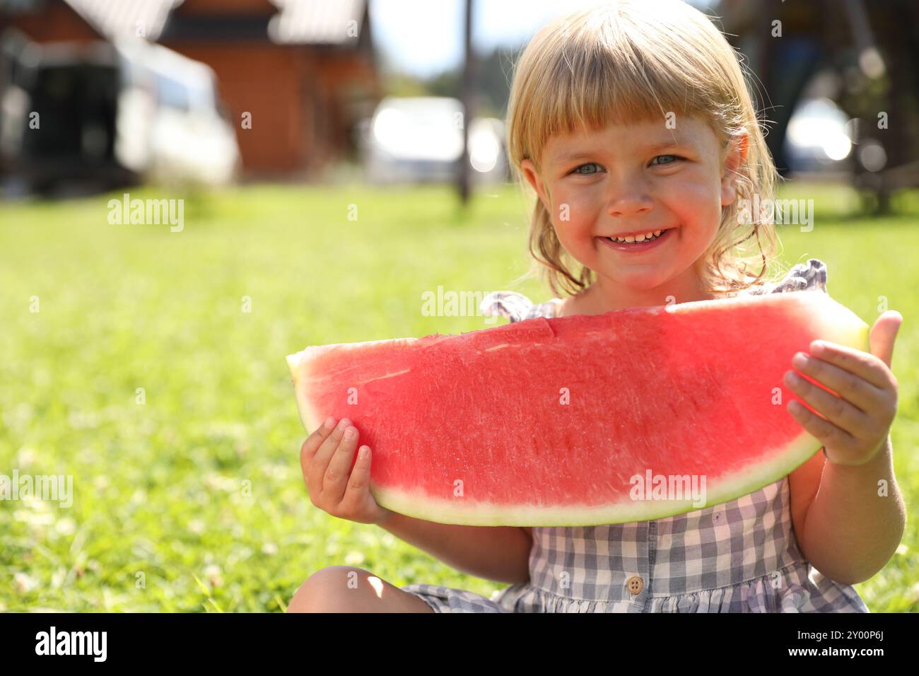 Cute little girl with slice of juicy watermelon outdoors Stock Photo ...