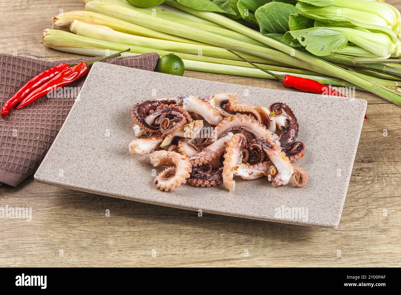 Grilled octopus red tentacle sliced appetizer Stock Photo - Alamy