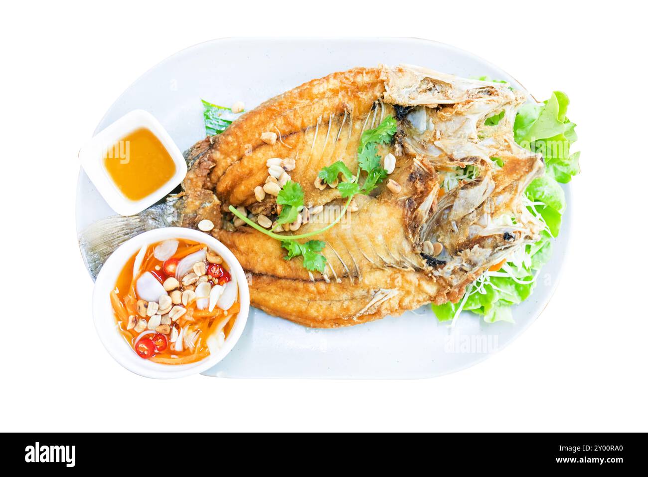 Die cut of Deep-Fried marinated snapper fish with fish sauce on white ...