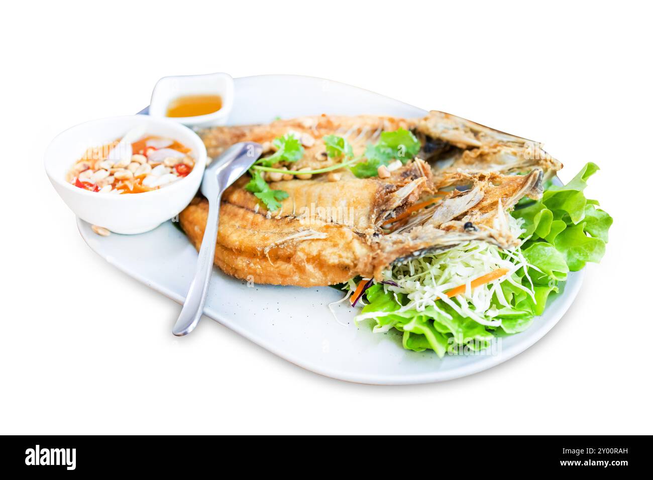 Die cut of Deep-Fried marinated snapper fish with fish sauce on white ...