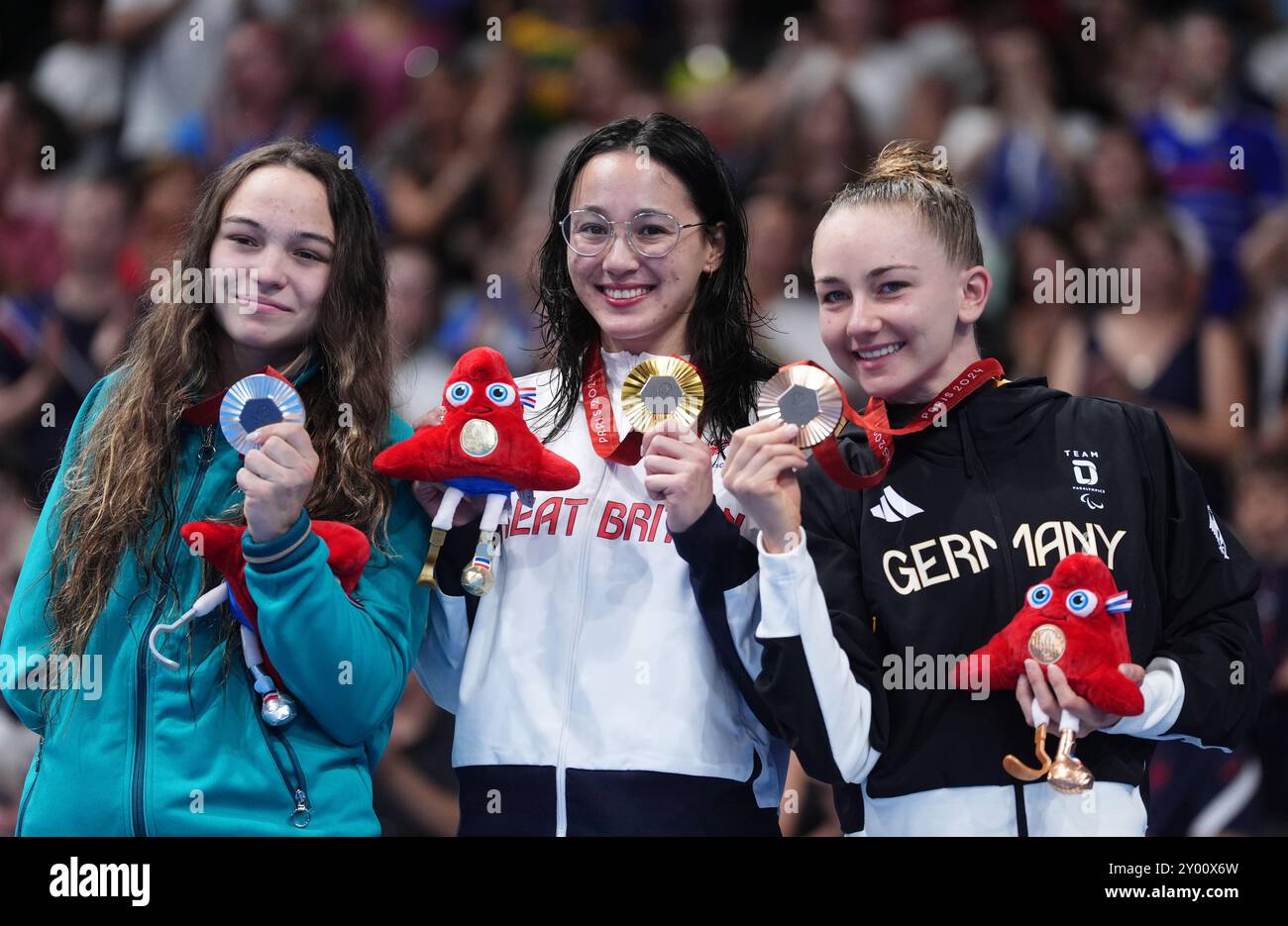 Great Britain's Alice Tai on the podium with the gold medal, alongside ...