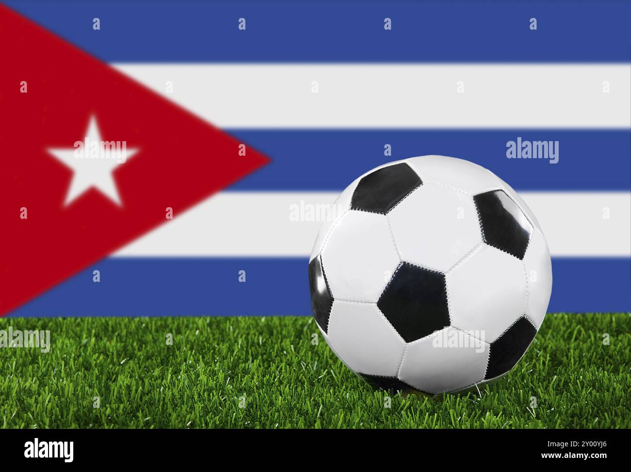 The Cuban flag and soccer ball on the green grass Stock Photo - Alamy