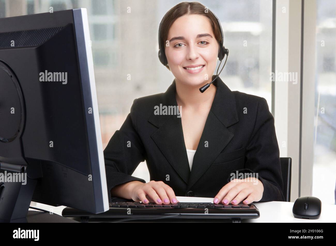 Corporate woman talking over her headset, isolated in a white background Stock Photo - Alamy