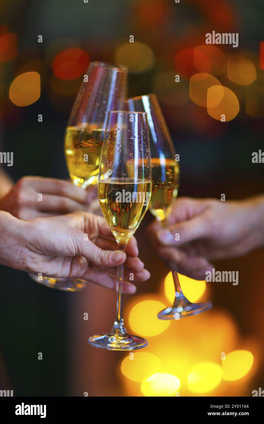 Holiday illuminations and champagne glass. Christmas party. Toast Stock ...