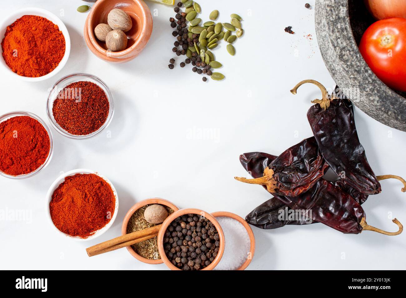 A top down view of salsa ingredients, featuring ground and dried chiles ...
