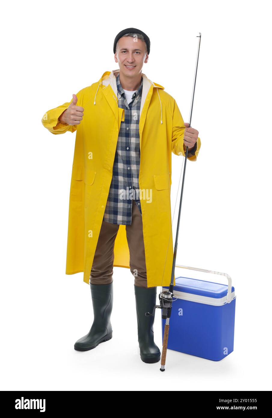 Smiling fisherman with rod showing thumbs up near cooler box on white ...