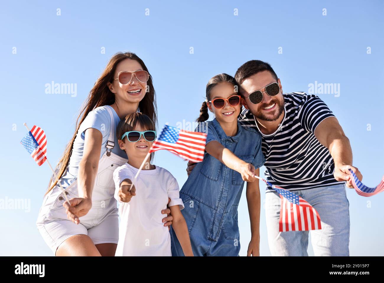 Happy family with flags of USA outdoors Stock Photo - Alamy