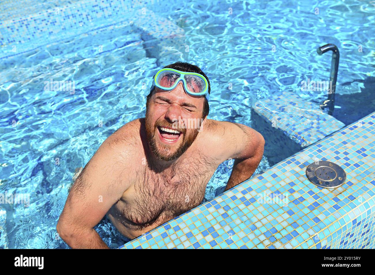 Funny man in diving mask jumping in pool, top view Stock Photo - Alamy