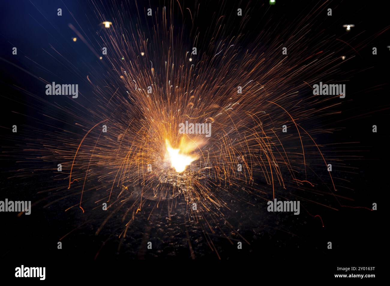 Yellow ground fireworks on asphalt Stock Photo - Alamy