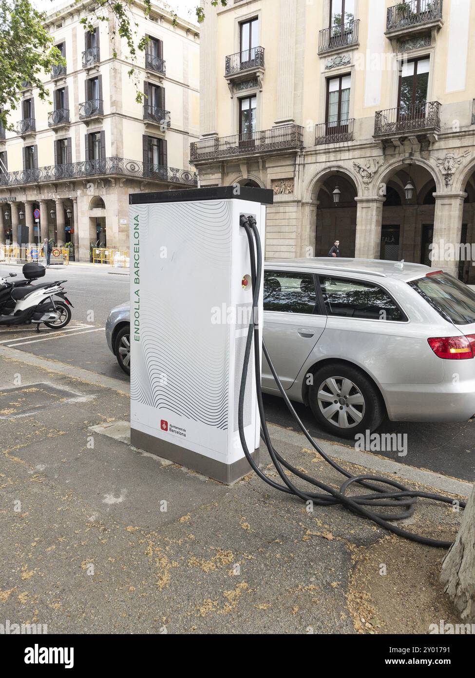 A car parked at a charging station in the city centre of Barcelona ...