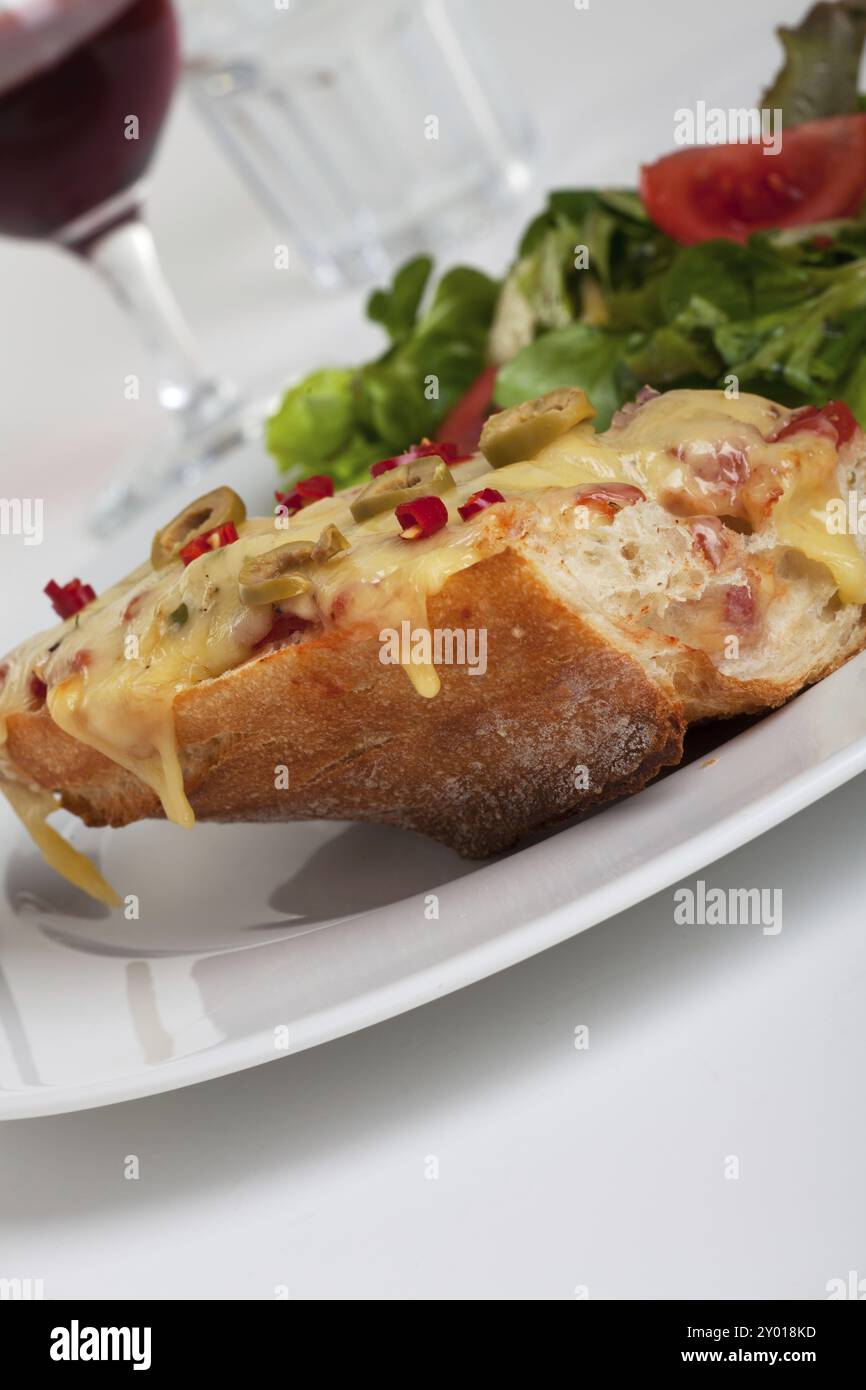 Close-up of a gratinated cheese baguette Stock Photo - Alamy
