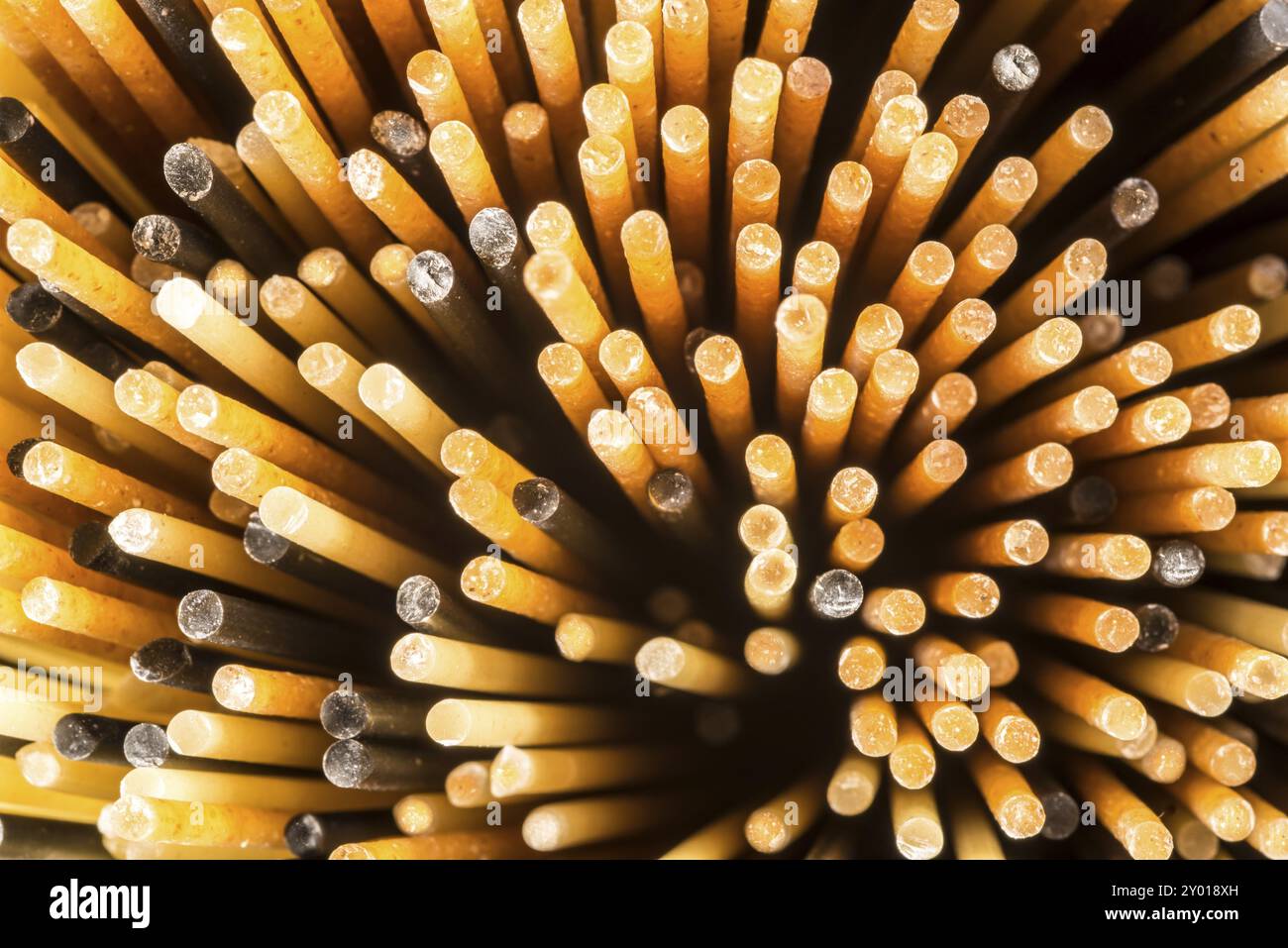 A close up view of the ends of three different types of spaghetti ...