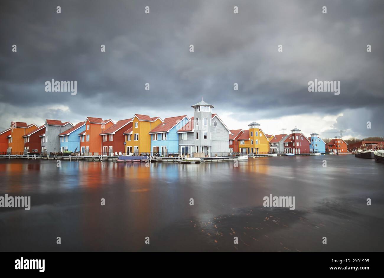 Colorful buildings on water during storm, Groningen, Netherlands Stock ...
