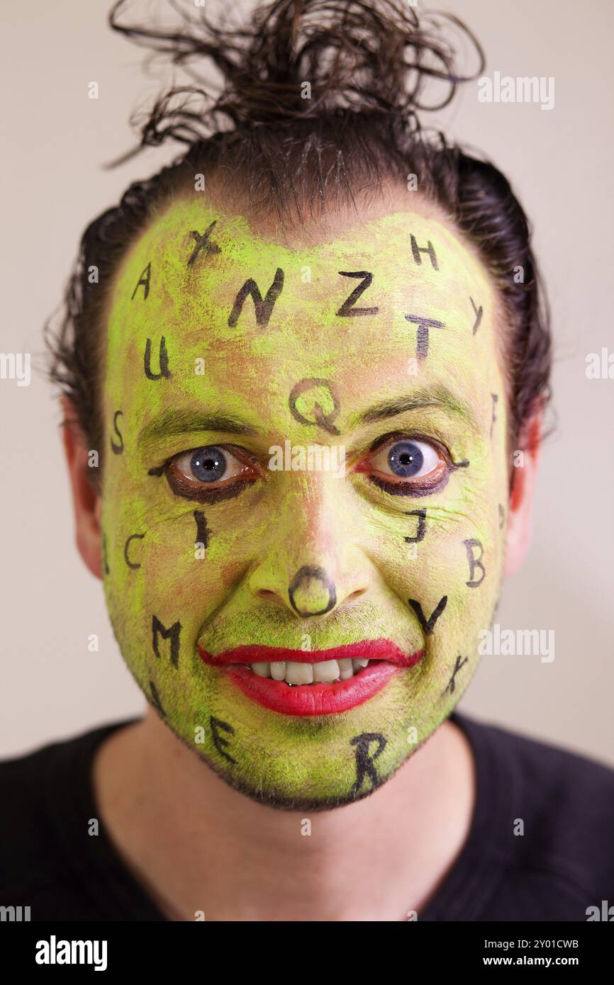 Portrait of a man with the alphabet painted on the face Portrait of a ...