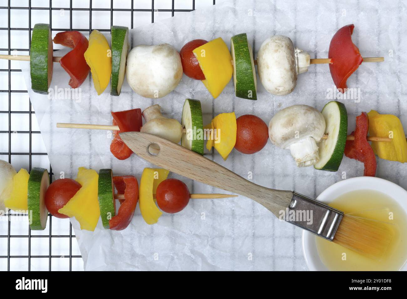 Colourful vegetable skewers with brush and marinade, raw barbecue ...