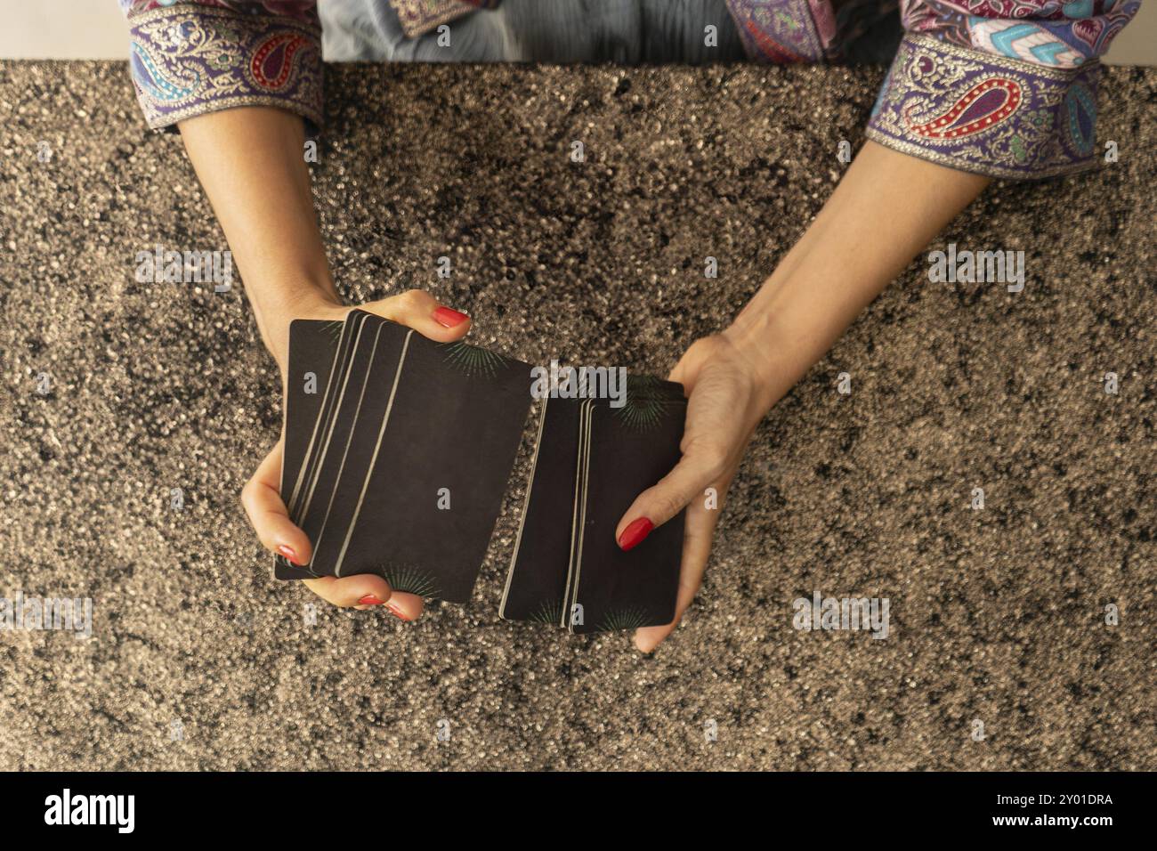 Top view of a tarot reader's hands mixing the deck of tarot cards Stock ...