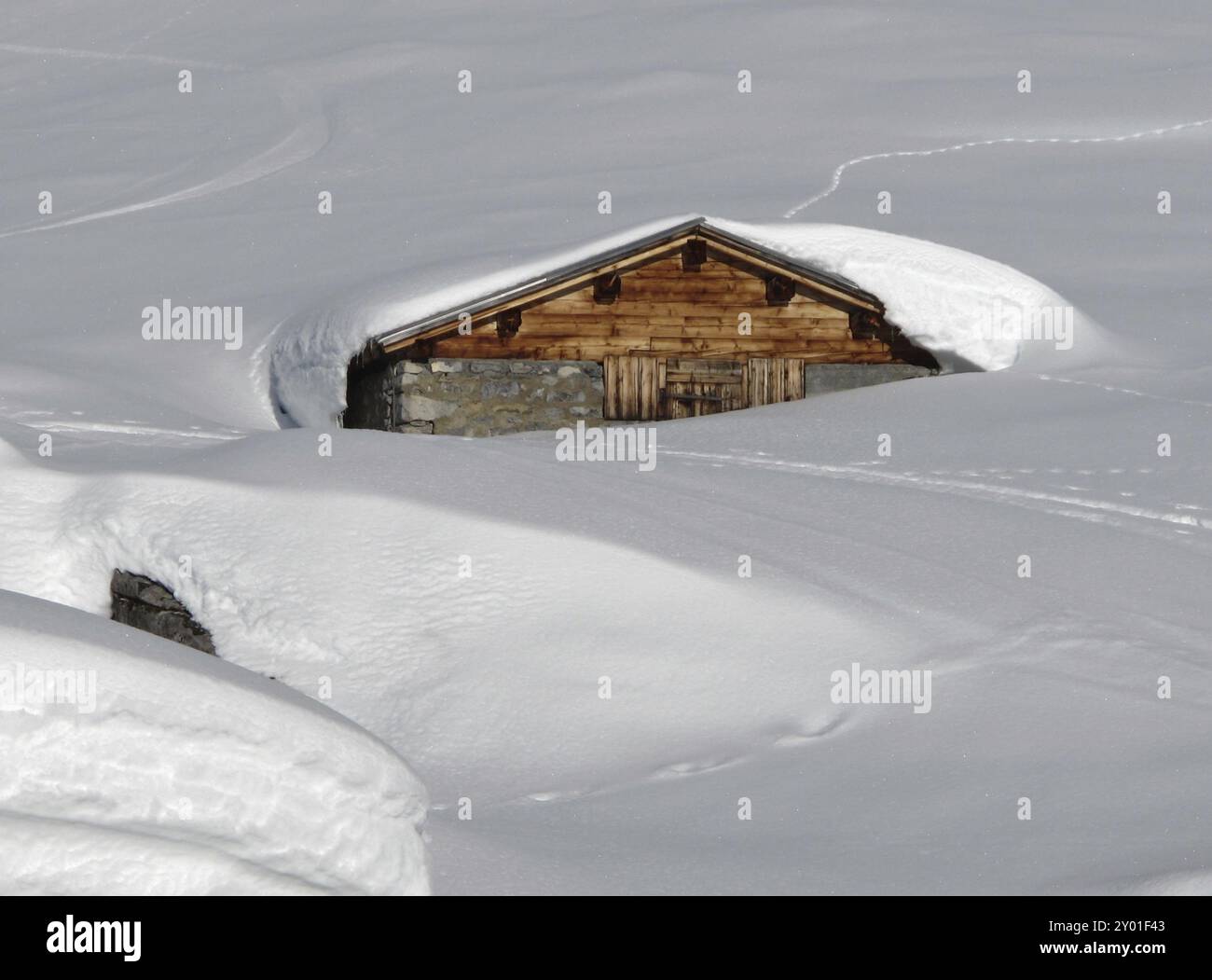 Timber hut, covered by lots of snow, Swiss Alps Stock Photo - Alamy