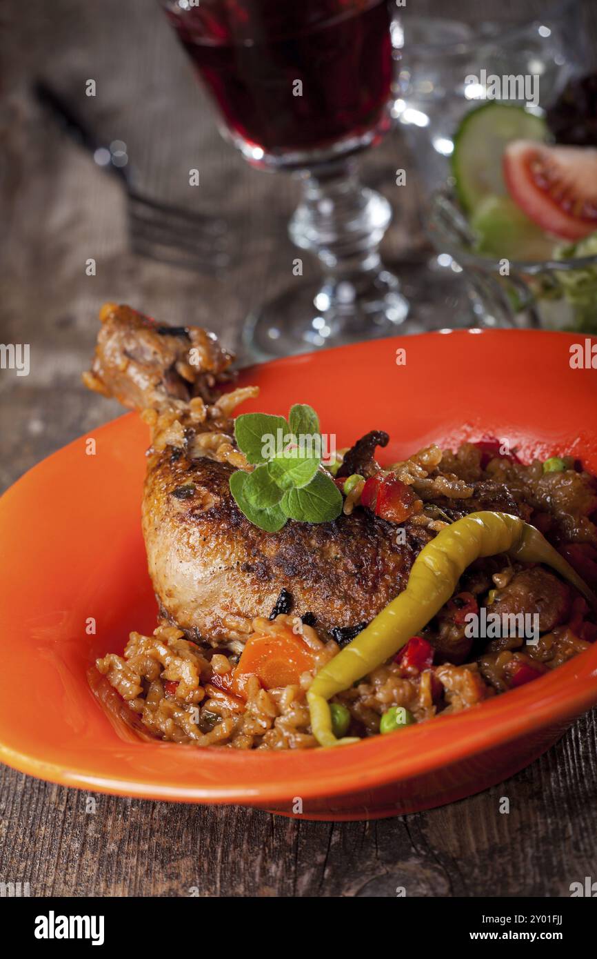 Grilled chicken leg on rice with chilli Stock Photo - Alamy