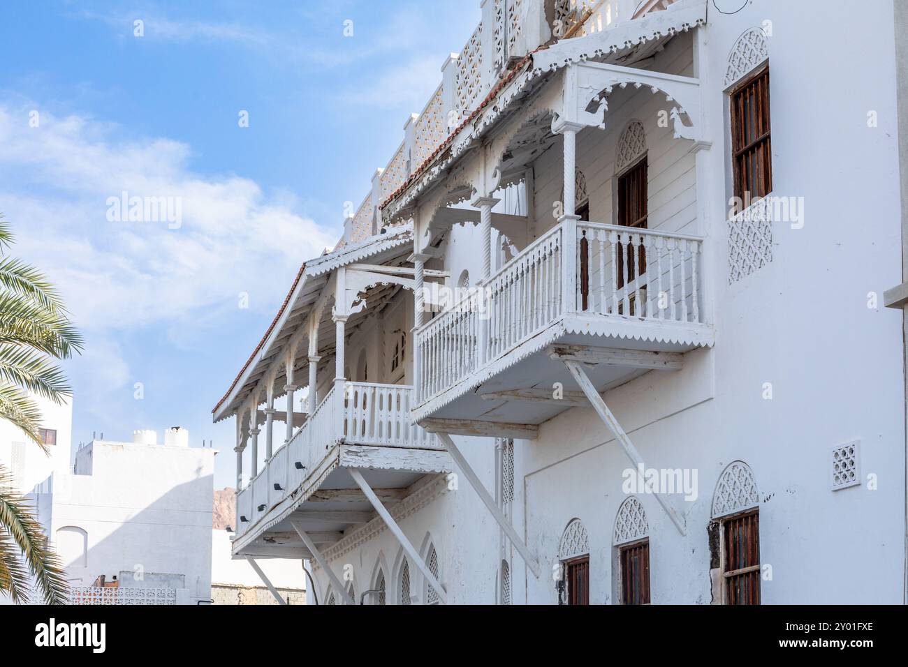 Traditional arab white buildings with decorated wooden windows and ...