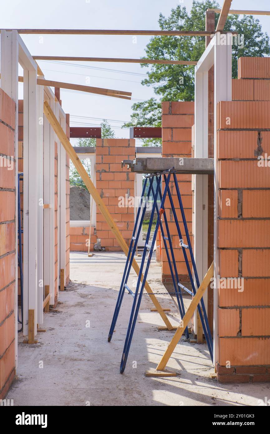 Newly built house corridor with walls and wooden frames Stock Photo - Alamy