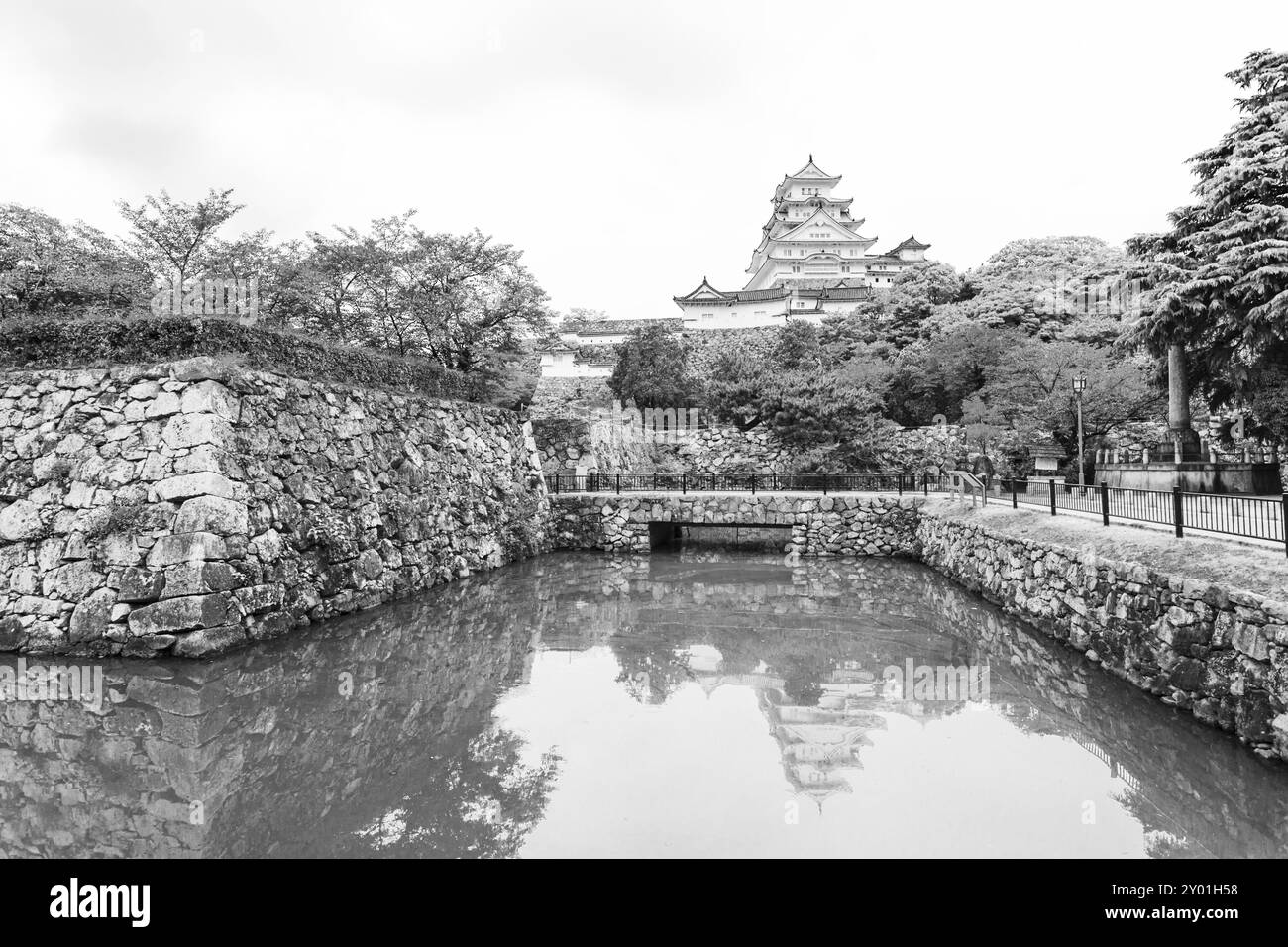 Himeji-jo castle reflection in green water of the surrounding moat and ...