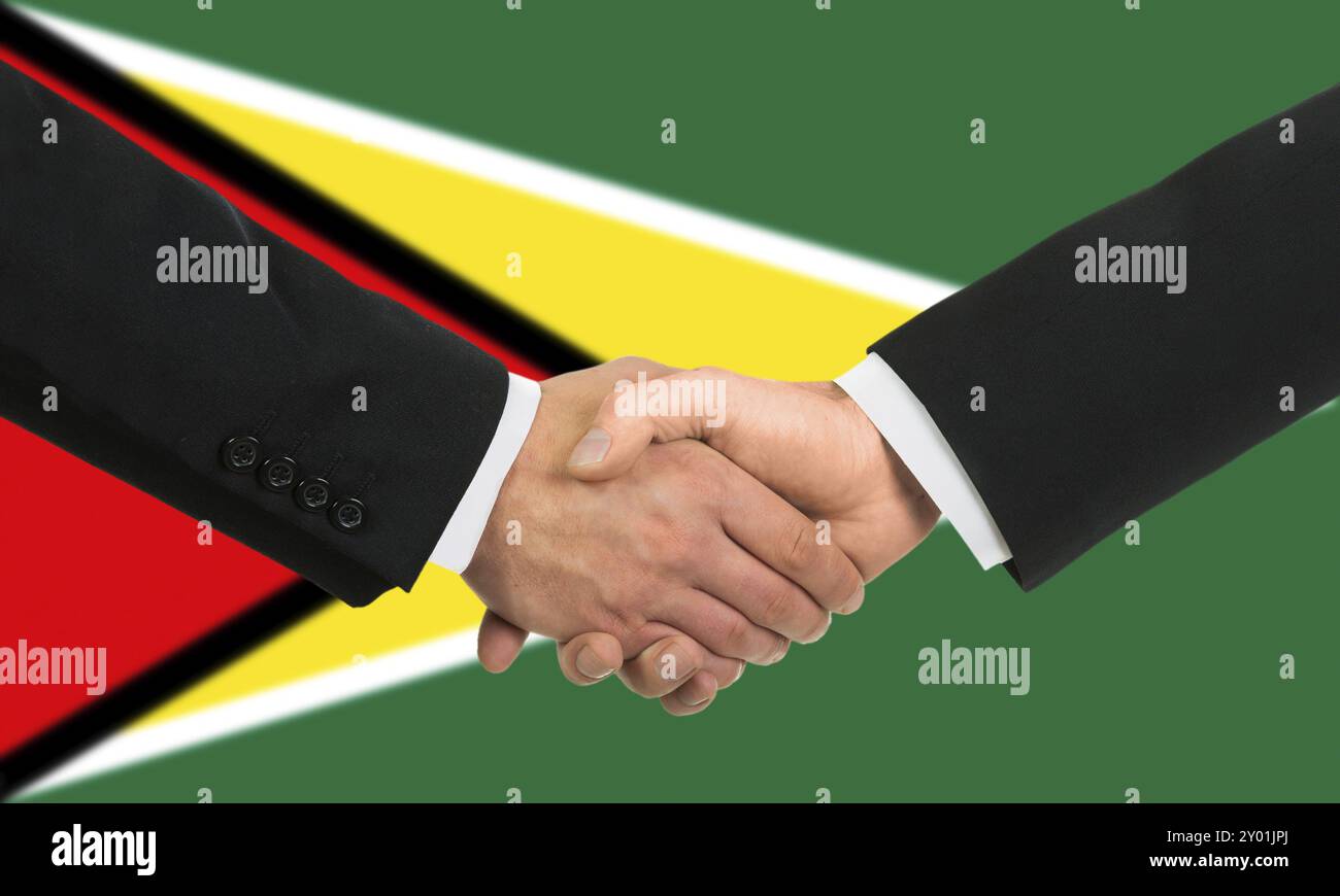 The Gayan flag and business handshake Stock Photo - Alamy